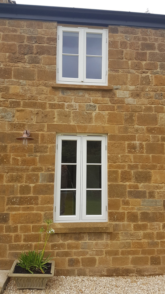 Timber Windows - Oxford project white Timber casements with horizontal bar